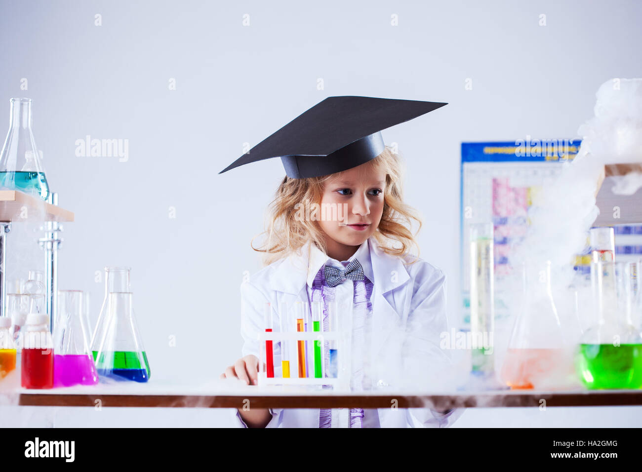 Studio shot of serious girl posing in chemical lab Stock Photo - Alamy