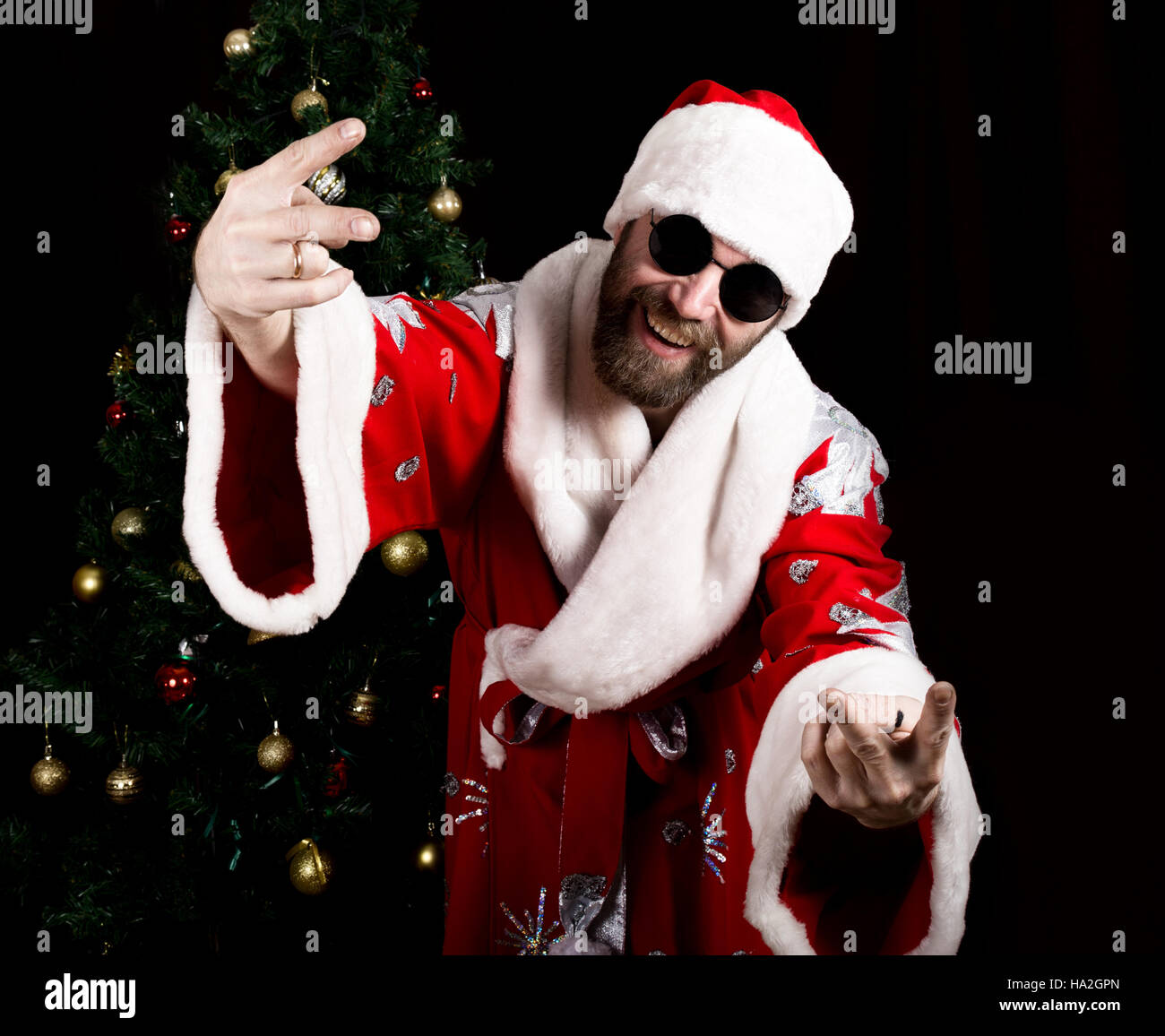 bad brutal Santa Claus smiles and showing finger sign on the background ...
