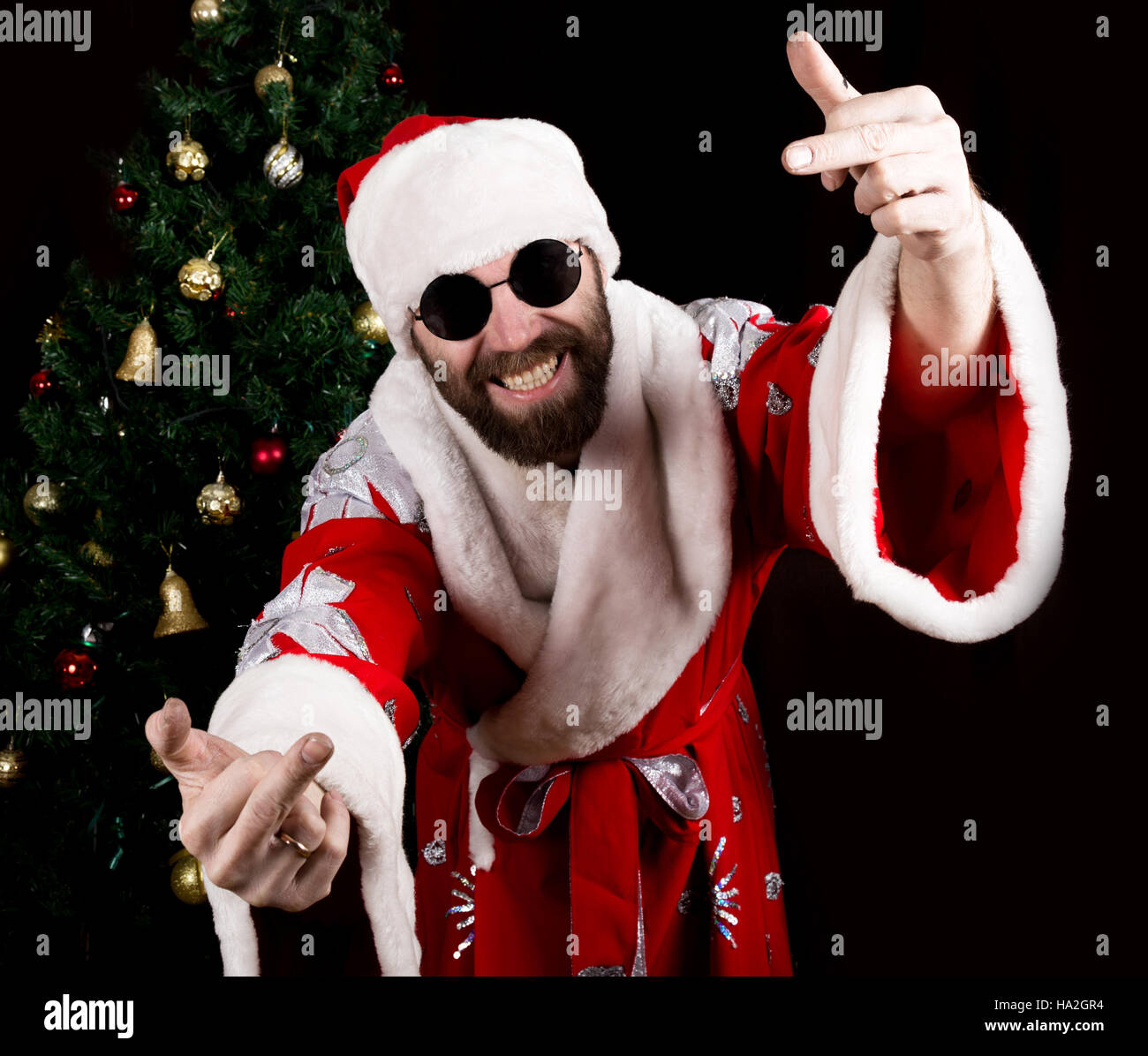bad brutal Santa Claus smiles and showing middle finger sign on the ...