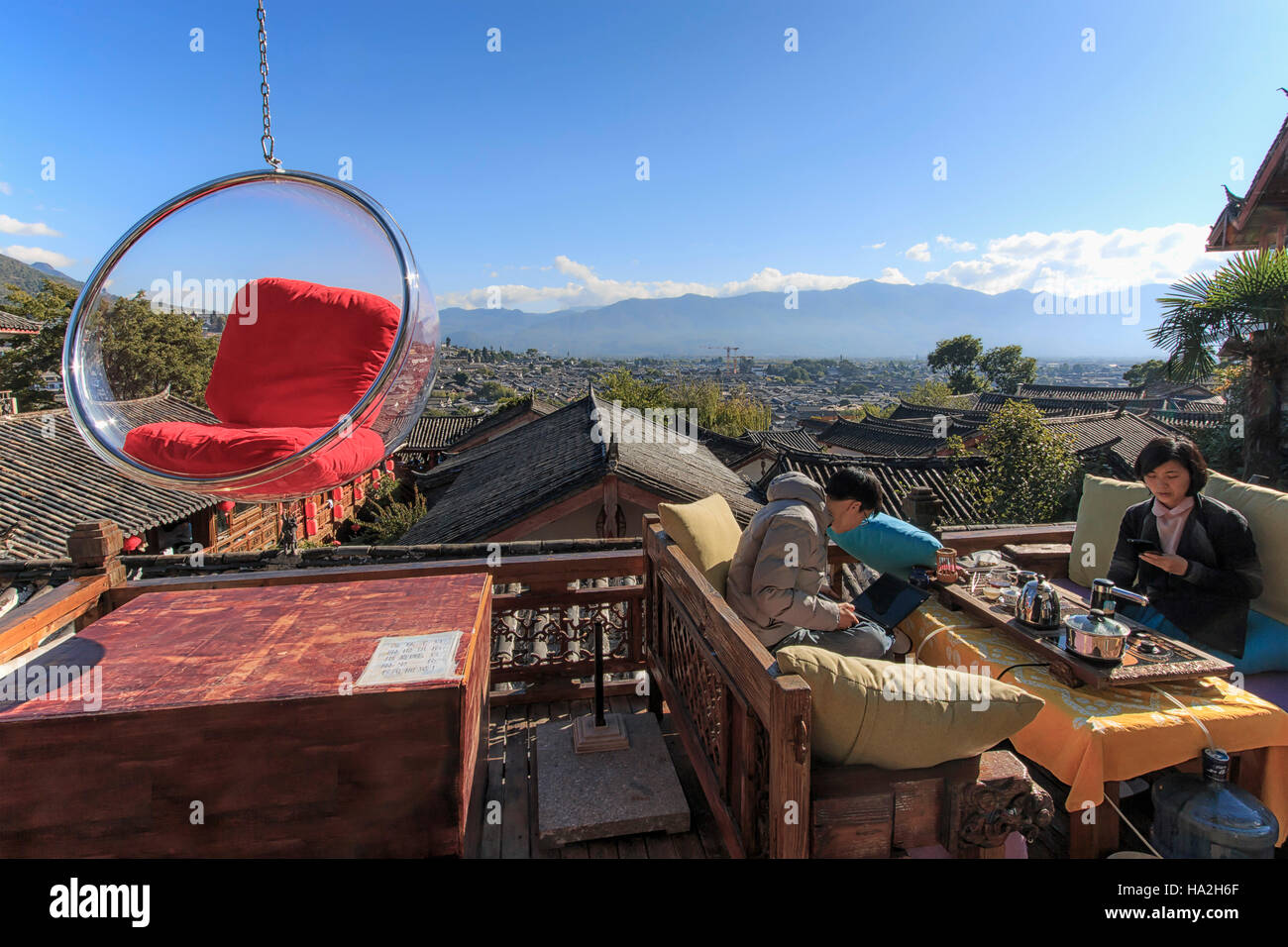 Lijiang, China - November 10, 2016: People relaxing on a couch and ...