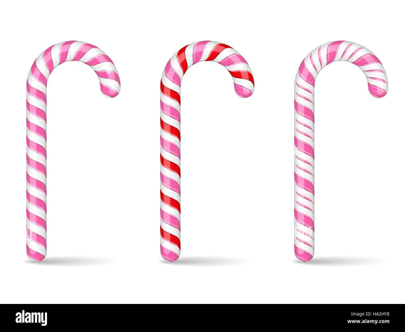 Pink and red candy canes on white background Stock Photo - Alamy