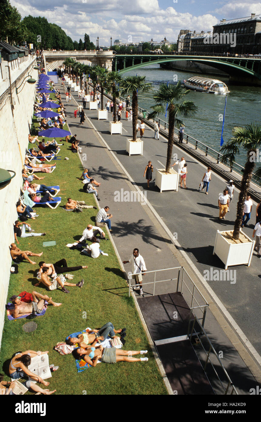 Paris, France - 2 April 2008: People sunbathing by the river Seine in ...