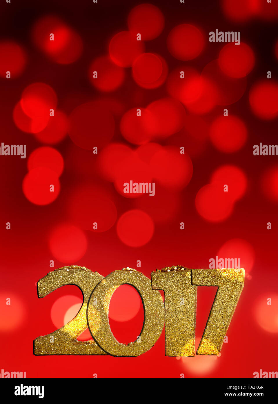 golden figures 2017 on red bokeh background Stock Photo - Alamy