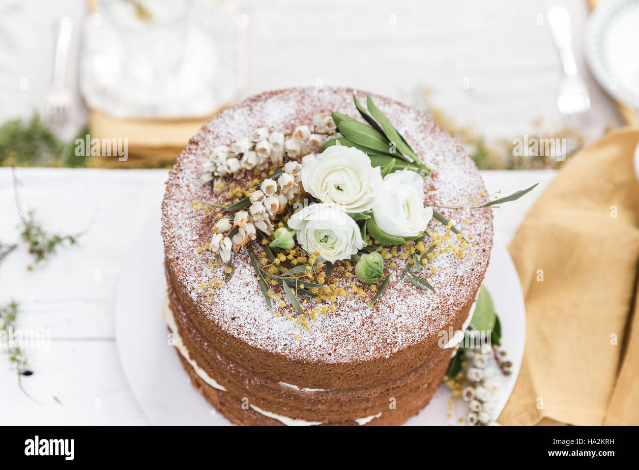 Triple layer victoria sponge cake on a table Stock Photo - Alamy
