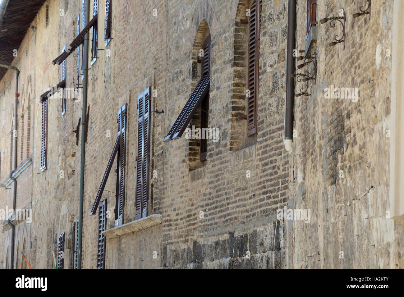 Half open vintage brown window shutters Stock Photo - Alamy