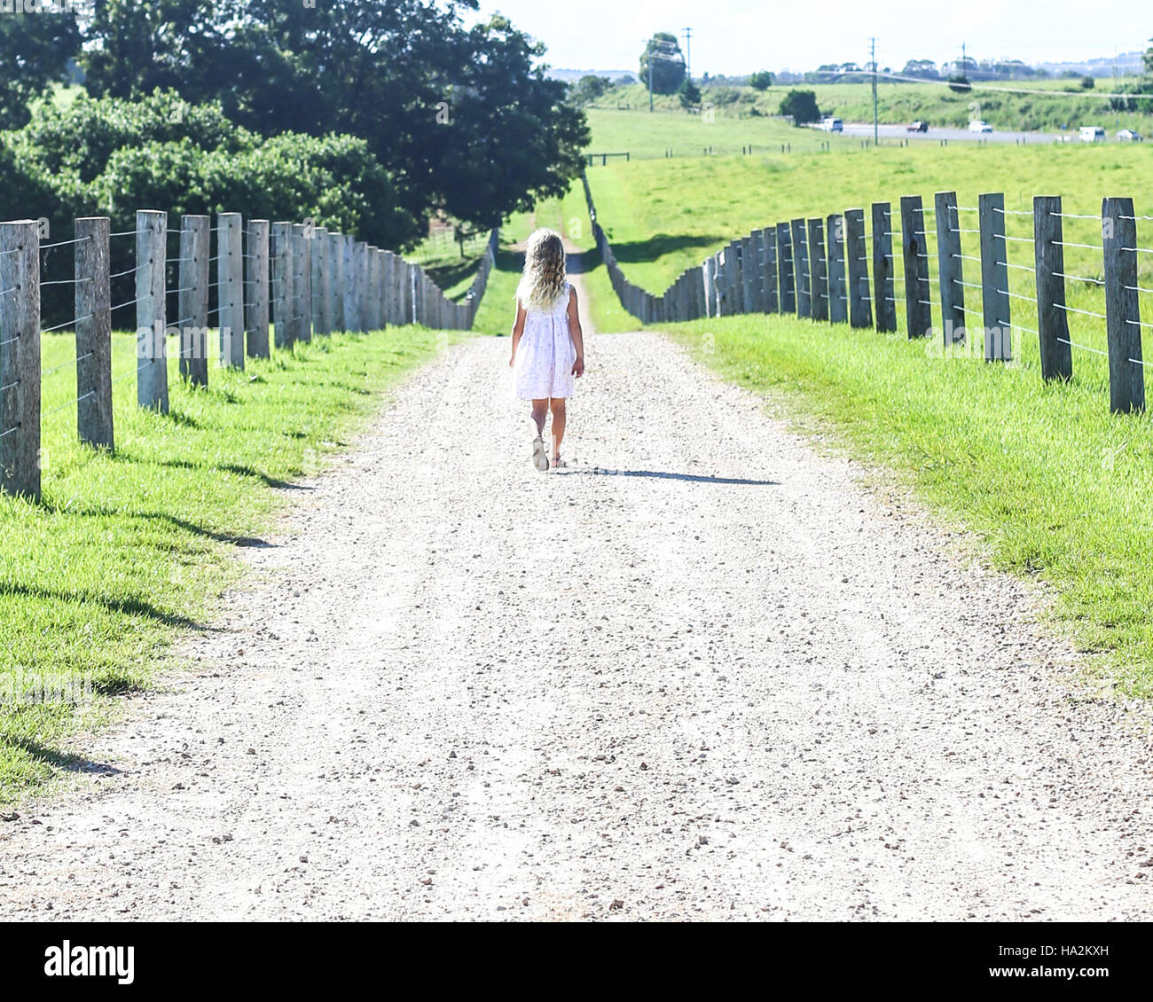 Girl walking road hi-res stock photography and images - Alamy