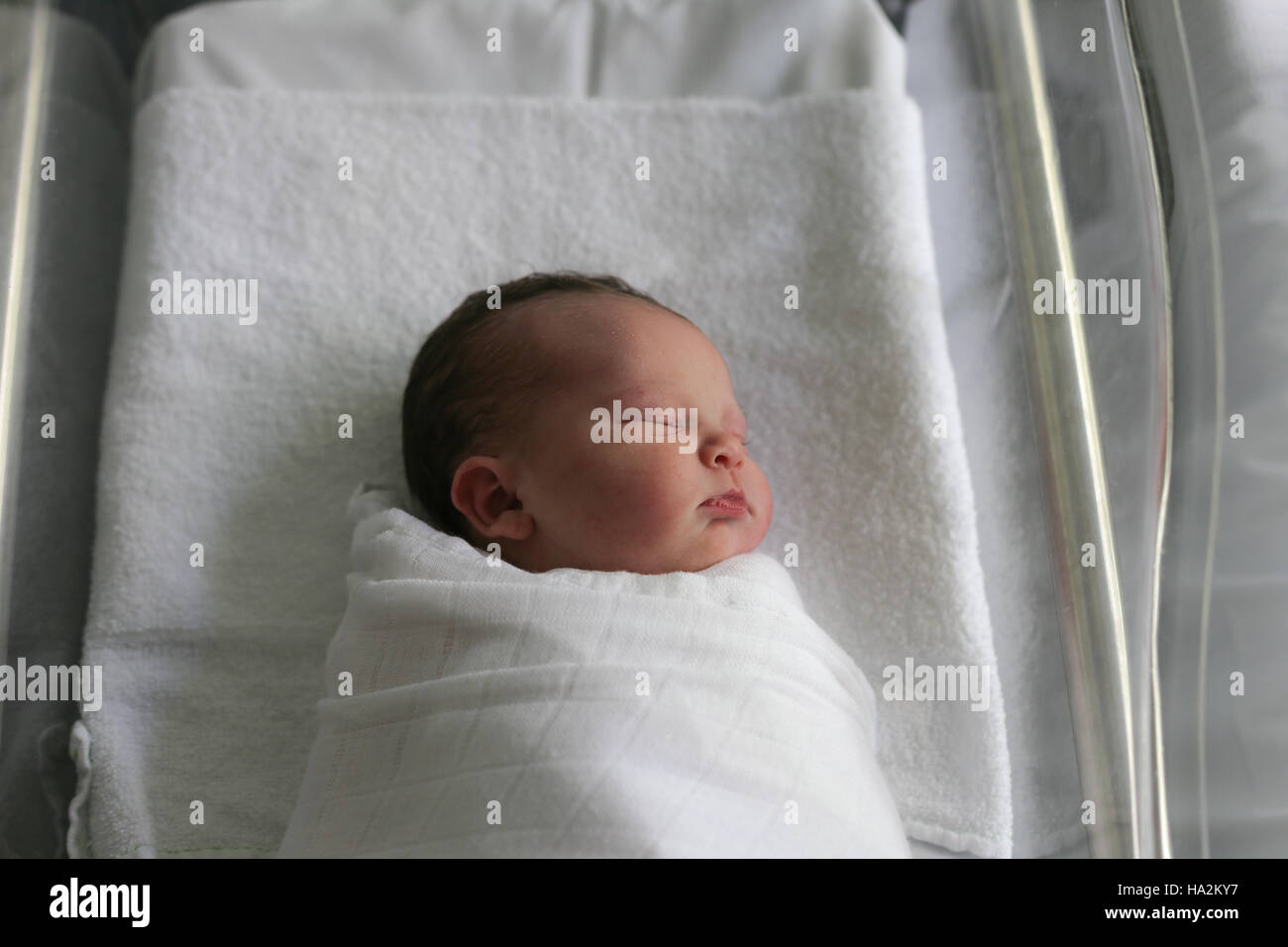 Newborn baby wrapped in a blanket Stock Photo - Alamy