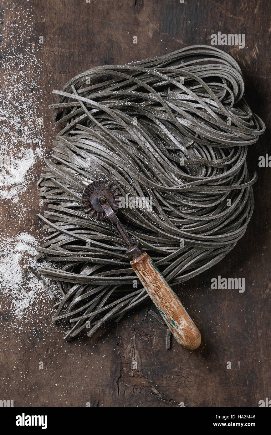 Raw black spaghetti pasta Stock Photo - Alamy