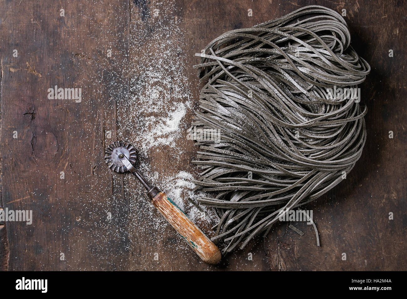 Raw black spaghetti pasta Stock Photo - Alamy