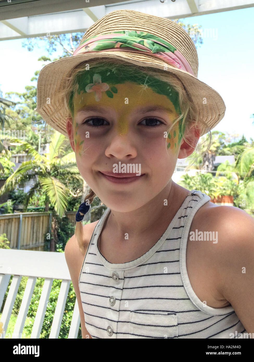 Portrait of a boy with face paint in a straw hat Stock Photo - Alamy