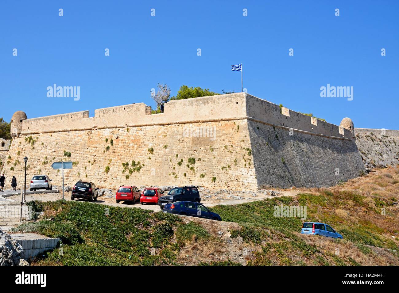 View of the Venetian castle with a Greek flag on top, Rethymno, Crete ...