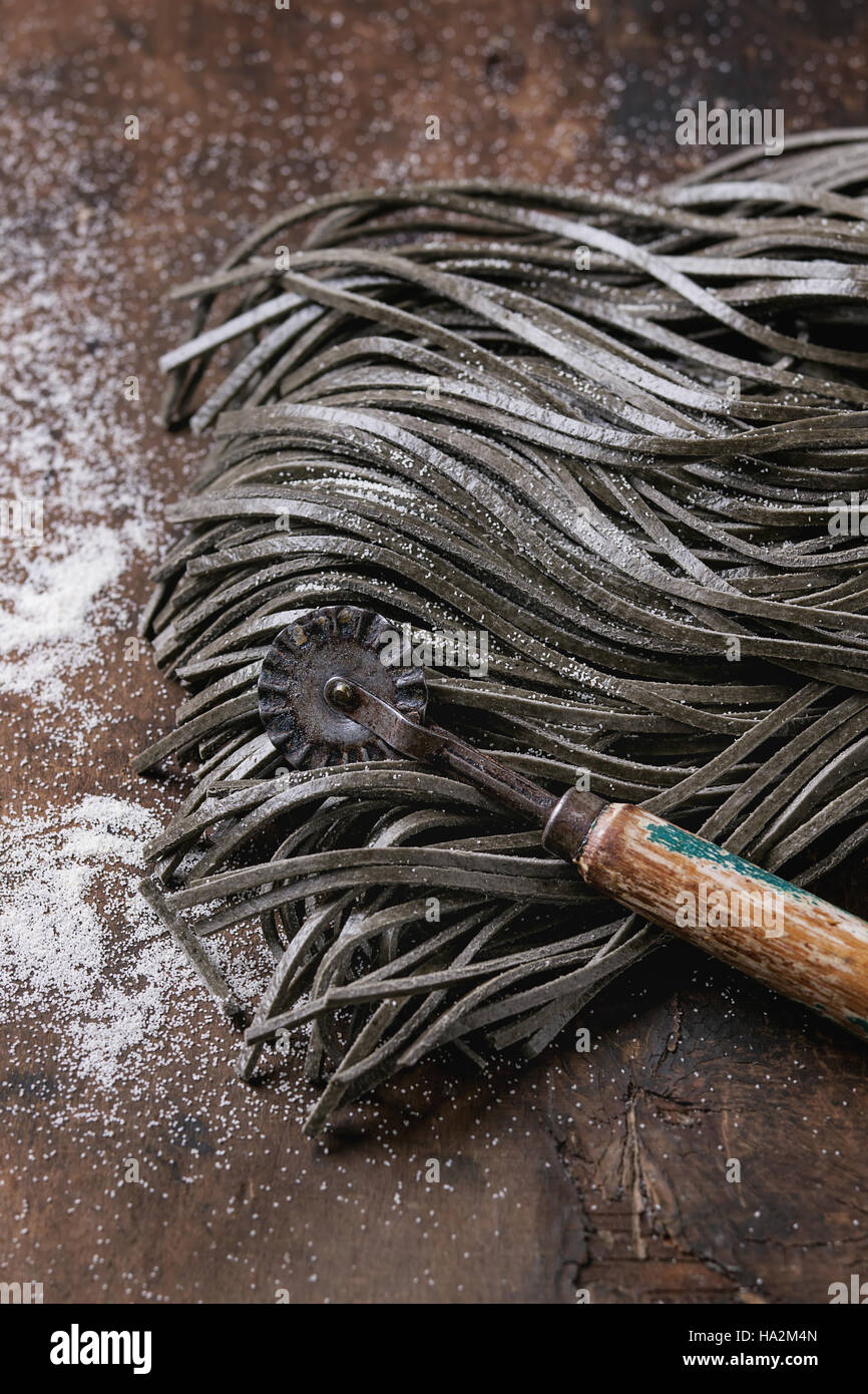 Raw black spaghetti pasta Stock Photo - Alamy