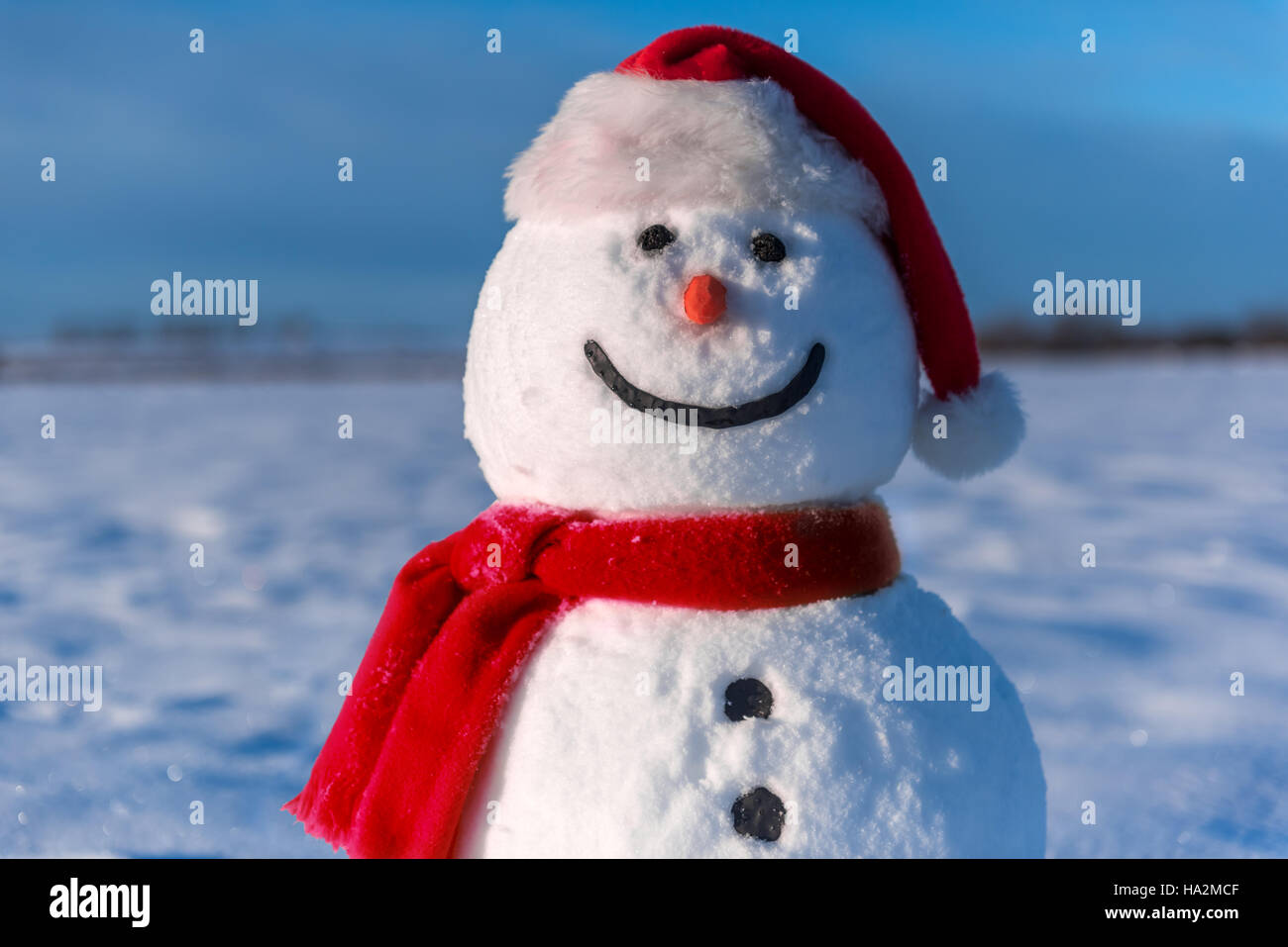 snowman on blue sky background Stock Photo - Alamy
