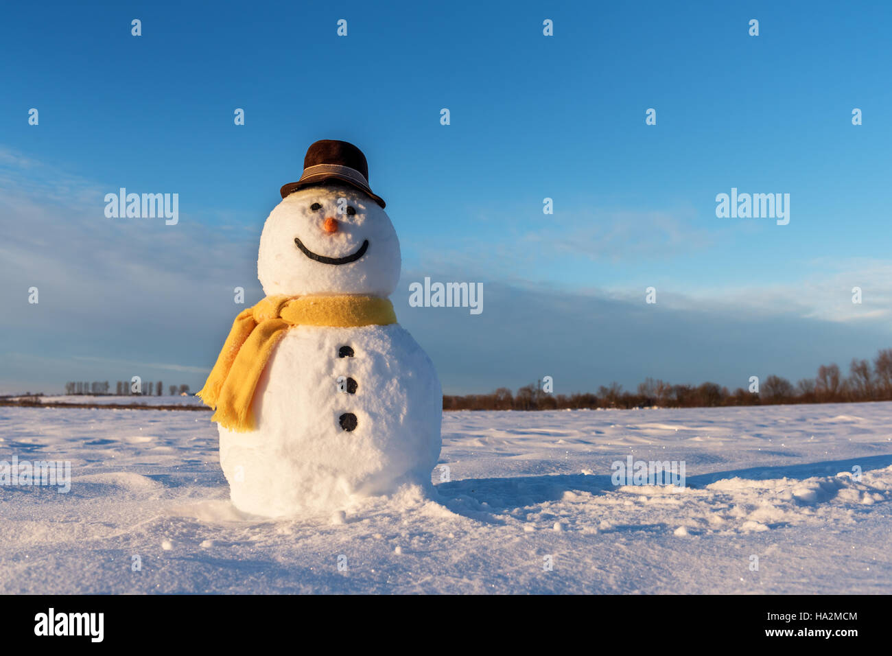 snowman on blue sky background Stock Photo - Alamy