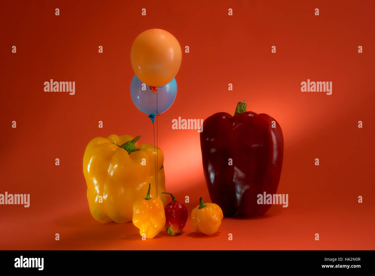 Conceptual family of peppers with balloons Stock Photo - Alamy