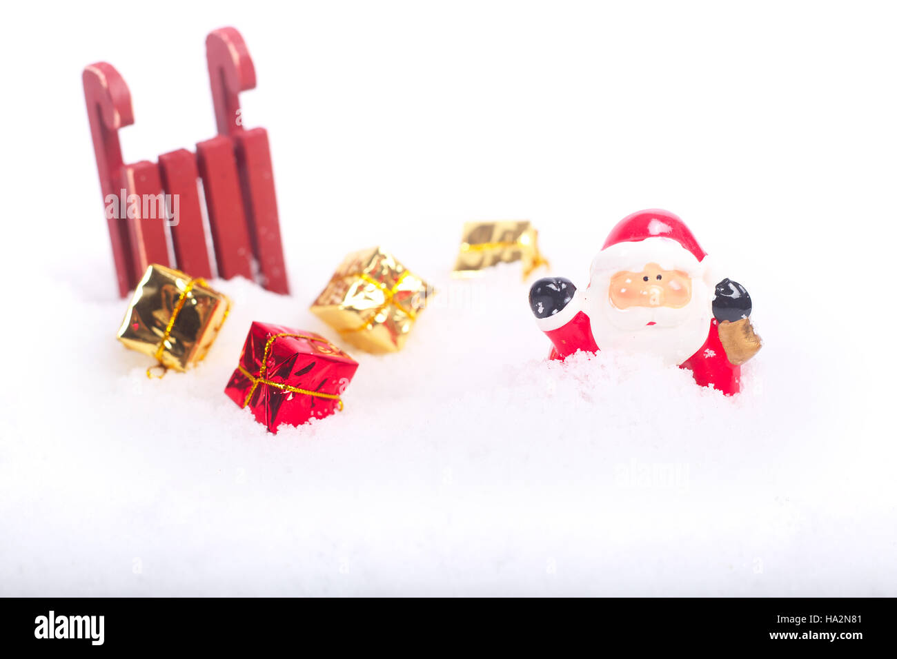 Santa Claus sledge accident in deep snow with gifts around Stock Photo ...