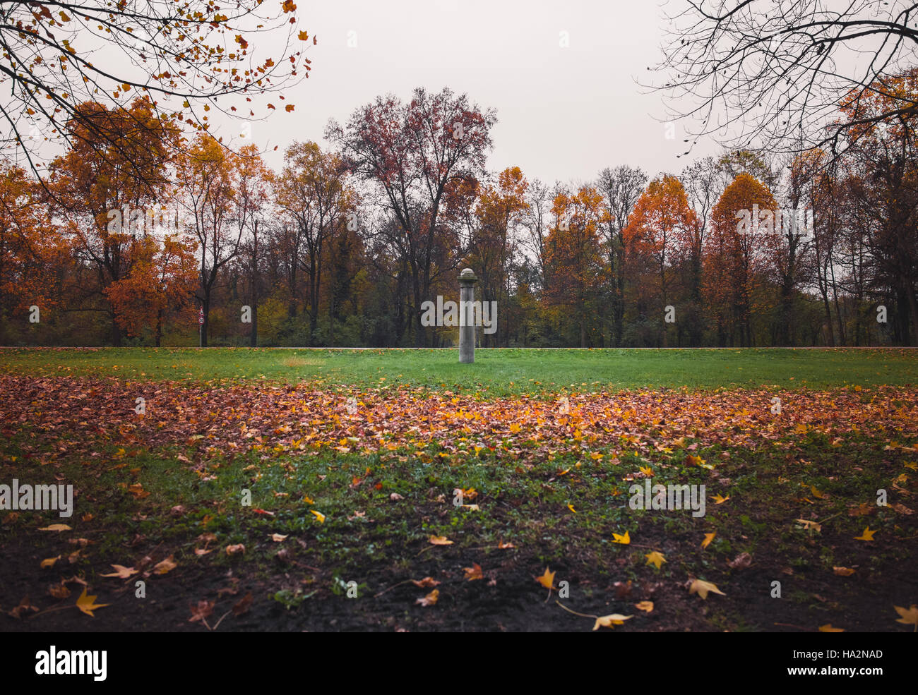 Stone column in a field of a park between the trees in autumn Stock ...