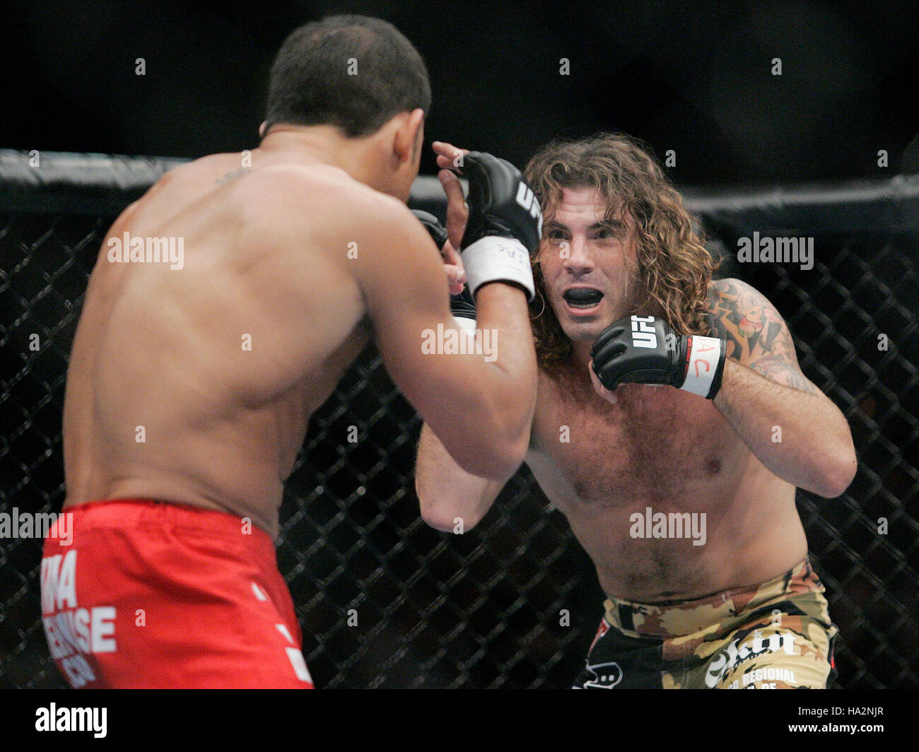 Clay Guida, right, fights Marcus Aurelio at UFC 74 during a mixed ...