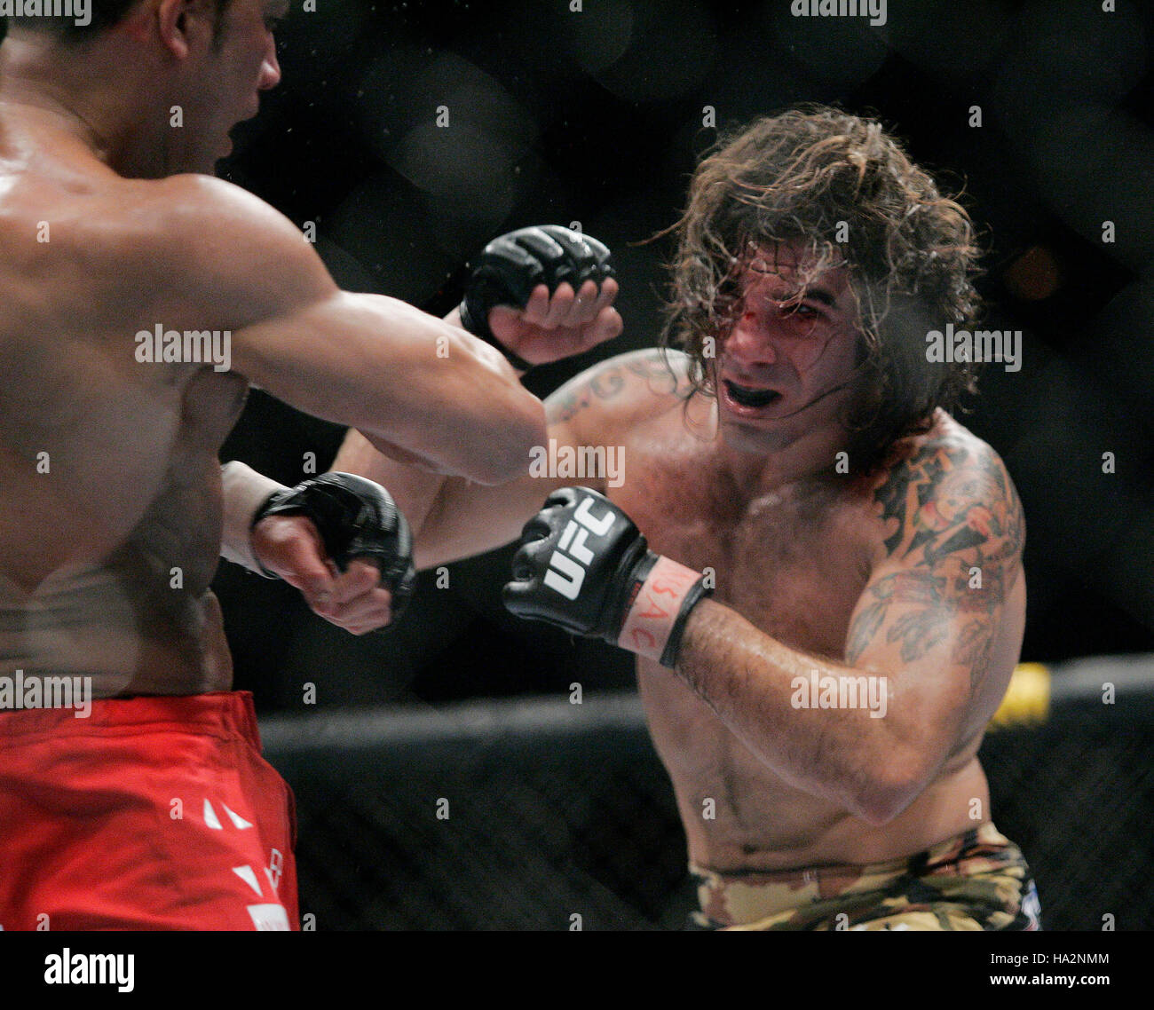 Clay Guida, right, fights Marcus Aurelio at UFC 74 during a mixed ...