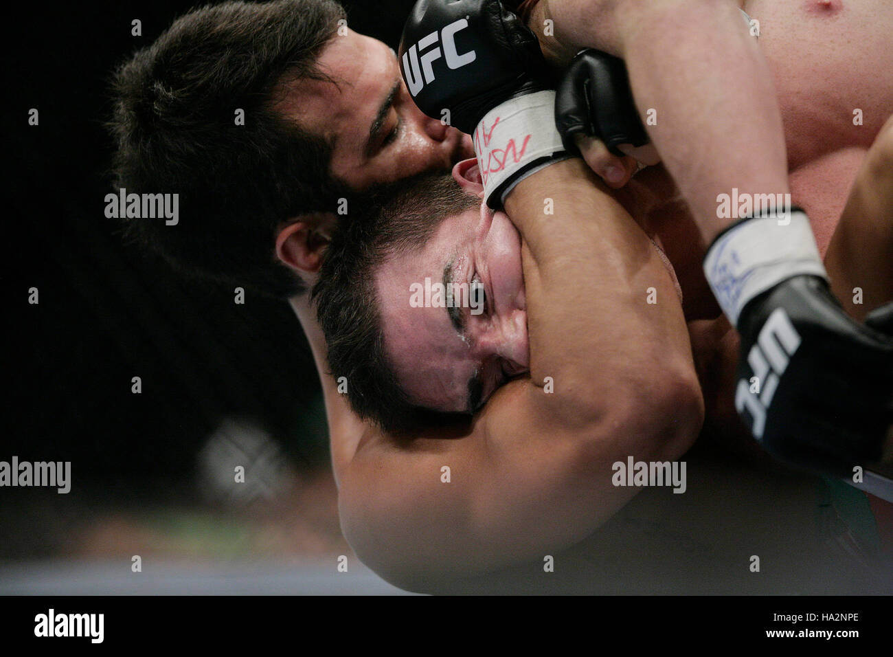Roger Huerta, top, fights Alberto Crane at UFC 74 during a mixed ...