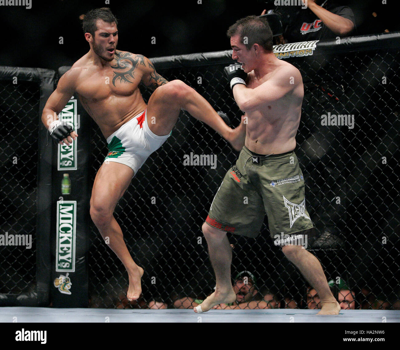 Roger Huerta, left, fights Alberto Crane at UFC 74 during a mixed ...