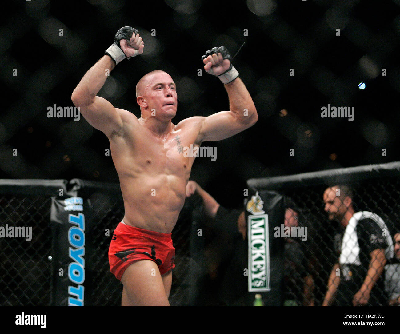 Georges St. Pierre celebrates his victory over Josh Koscheck at UFC 74 ...
