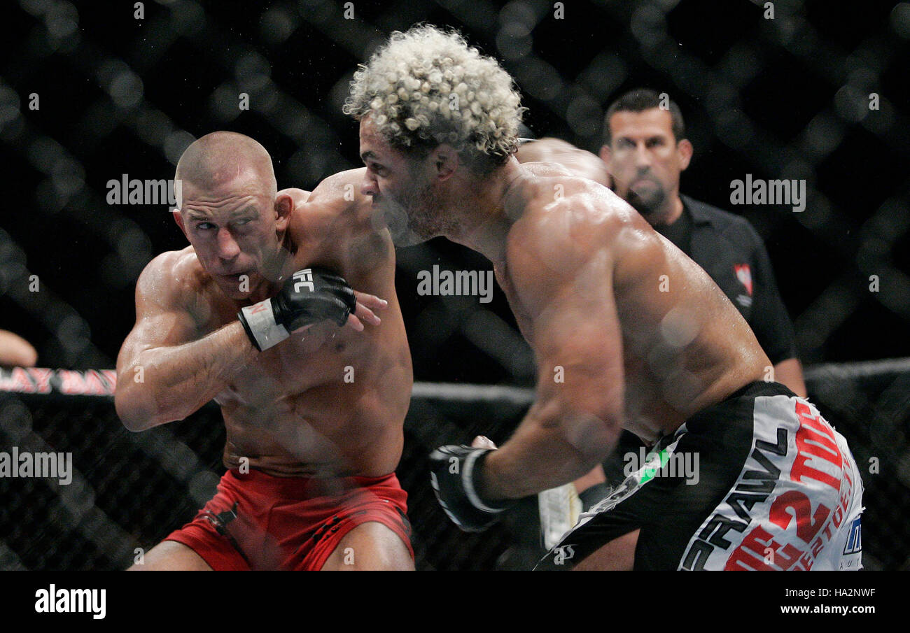 Georges St. Pierre, left, punches Josh Koscheck at UFC 74 during a ...