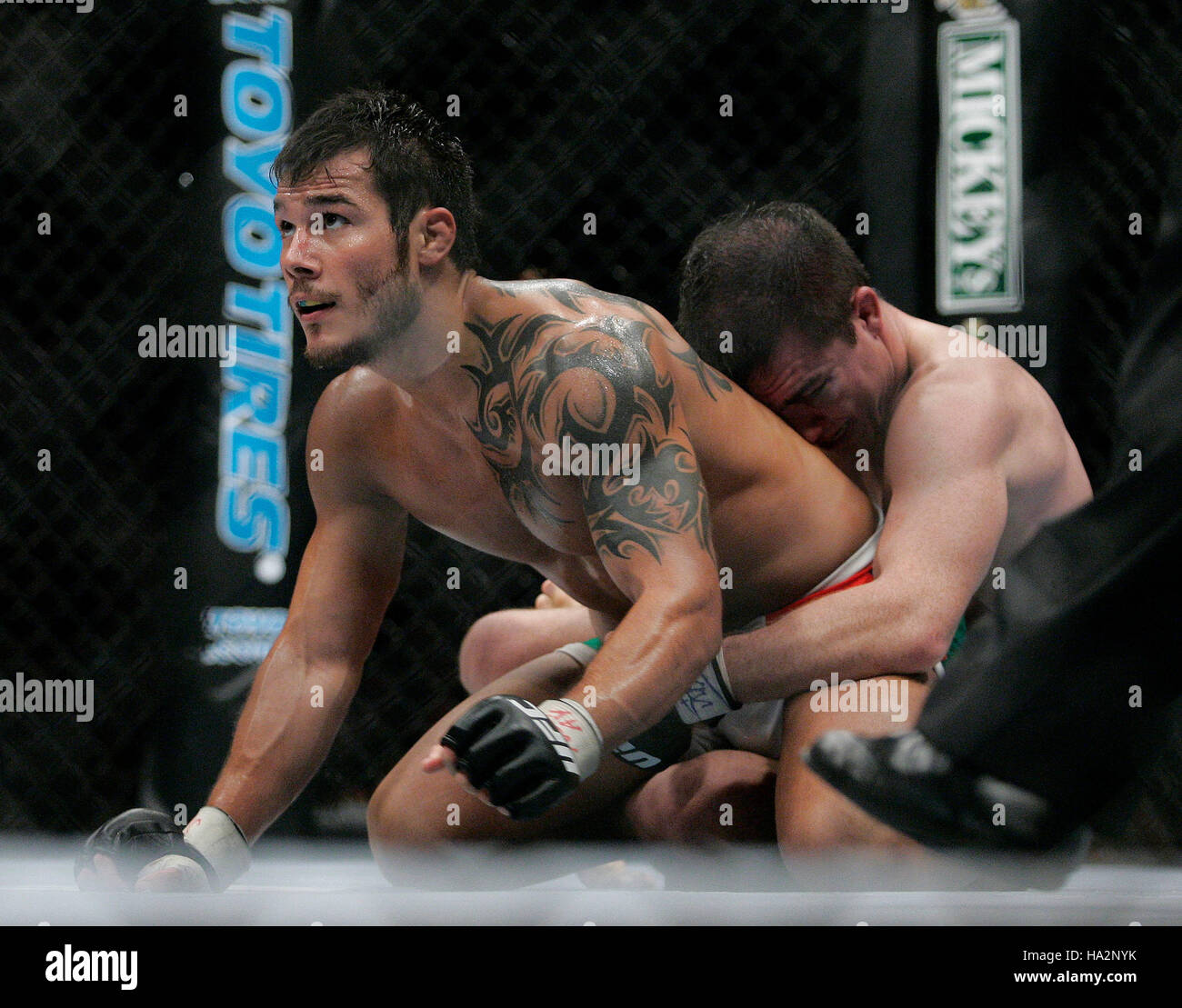 Roger Huerta, left, fights, Alberto Crane at UFC 74 during a mixed ...