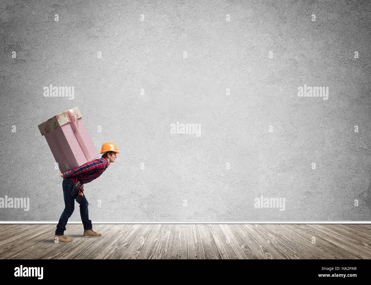 Man carrying on his back large box Stock Photo - Alamy