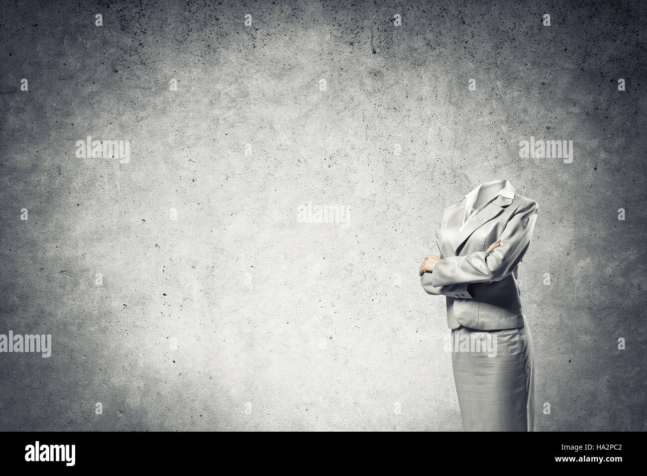 Headless businesswoman with arms crossed on chest on gray background ...