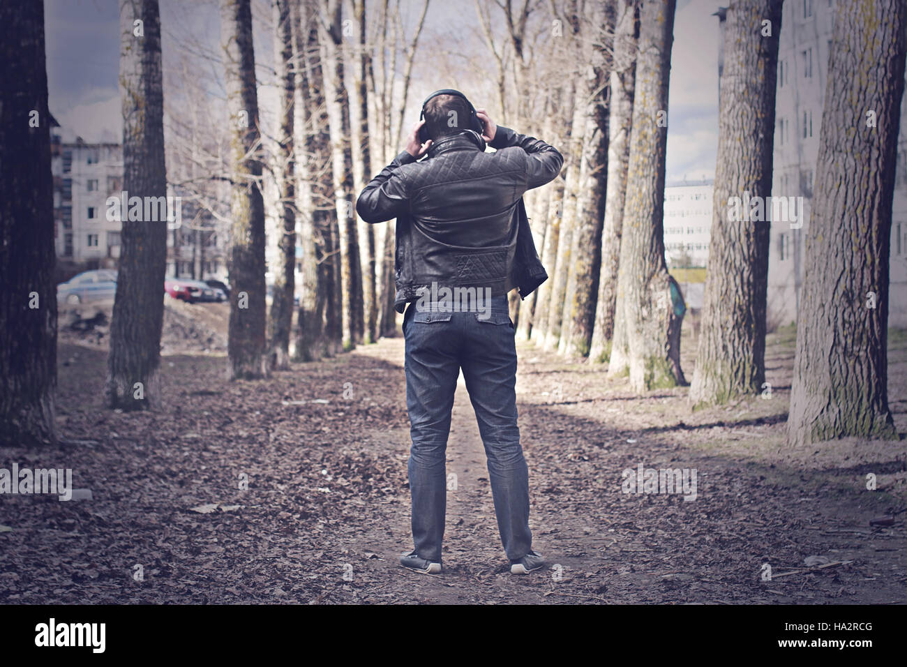 retro toned effected photo of alone man on street Stock Photo - Alamy