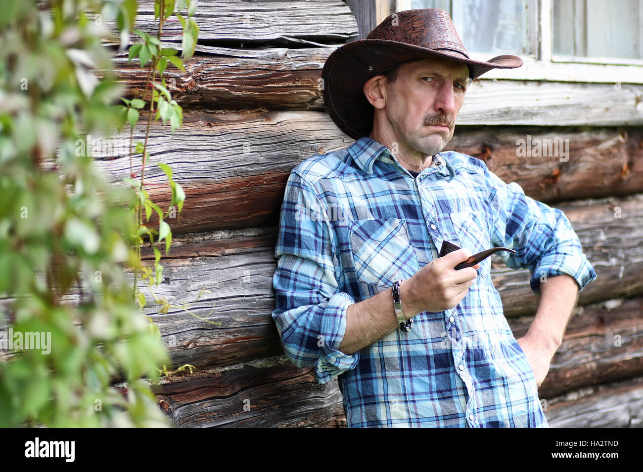 cowboy man smoke pipe Stock Photo - Alamy