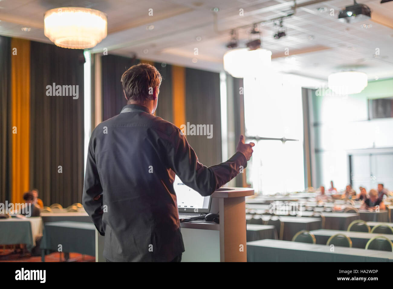 Public speaker giving talk at business event Stock Photo - Alamy