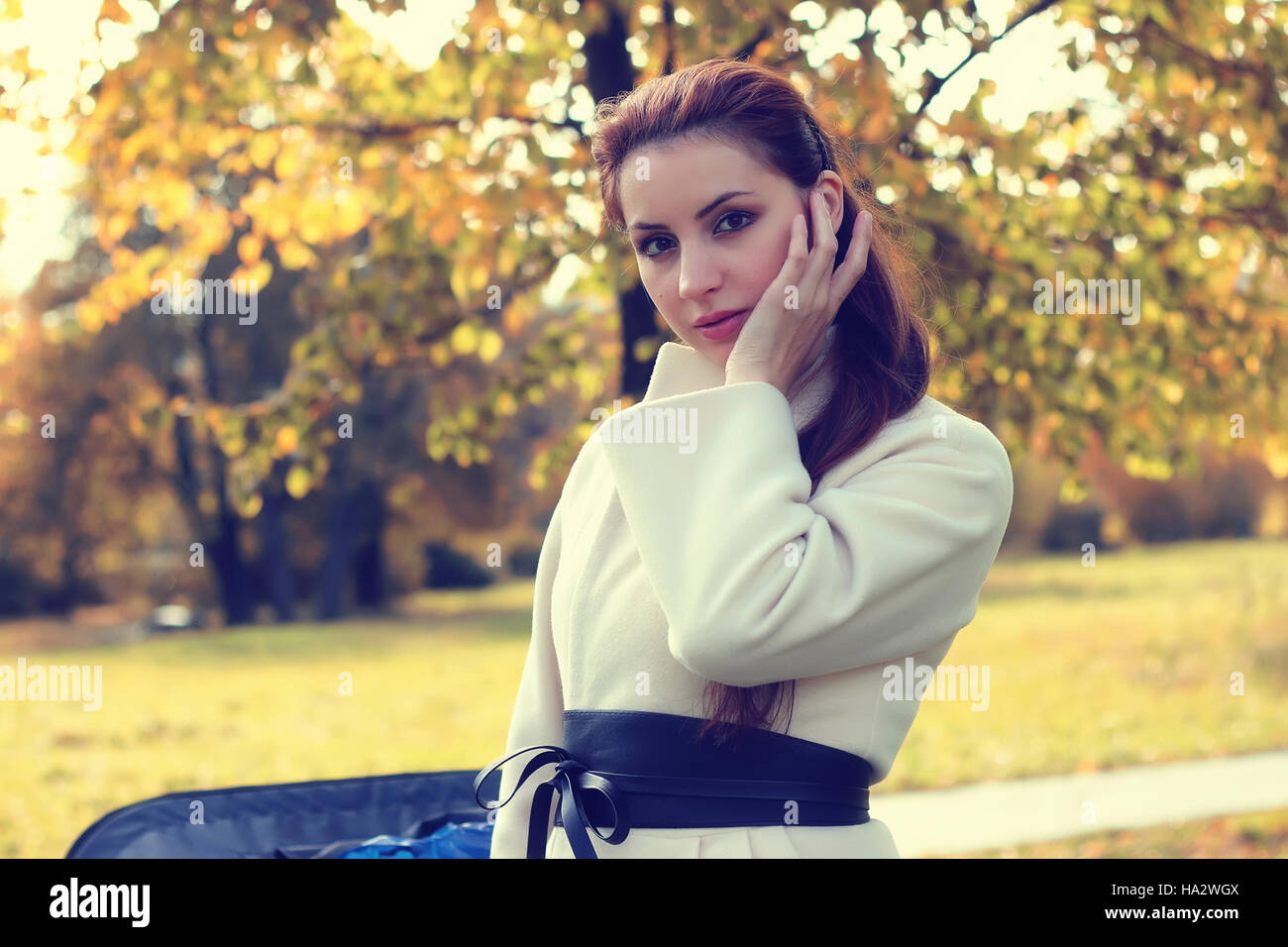 girl in a park walk autumn alone Stock Photo - Alamy