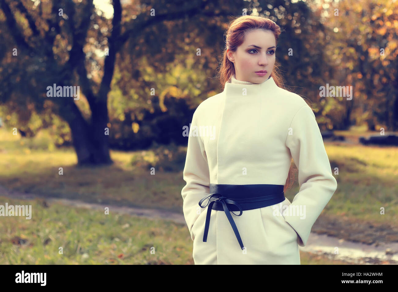 girl in a park walk autumn alone Stock Photo - Alamy