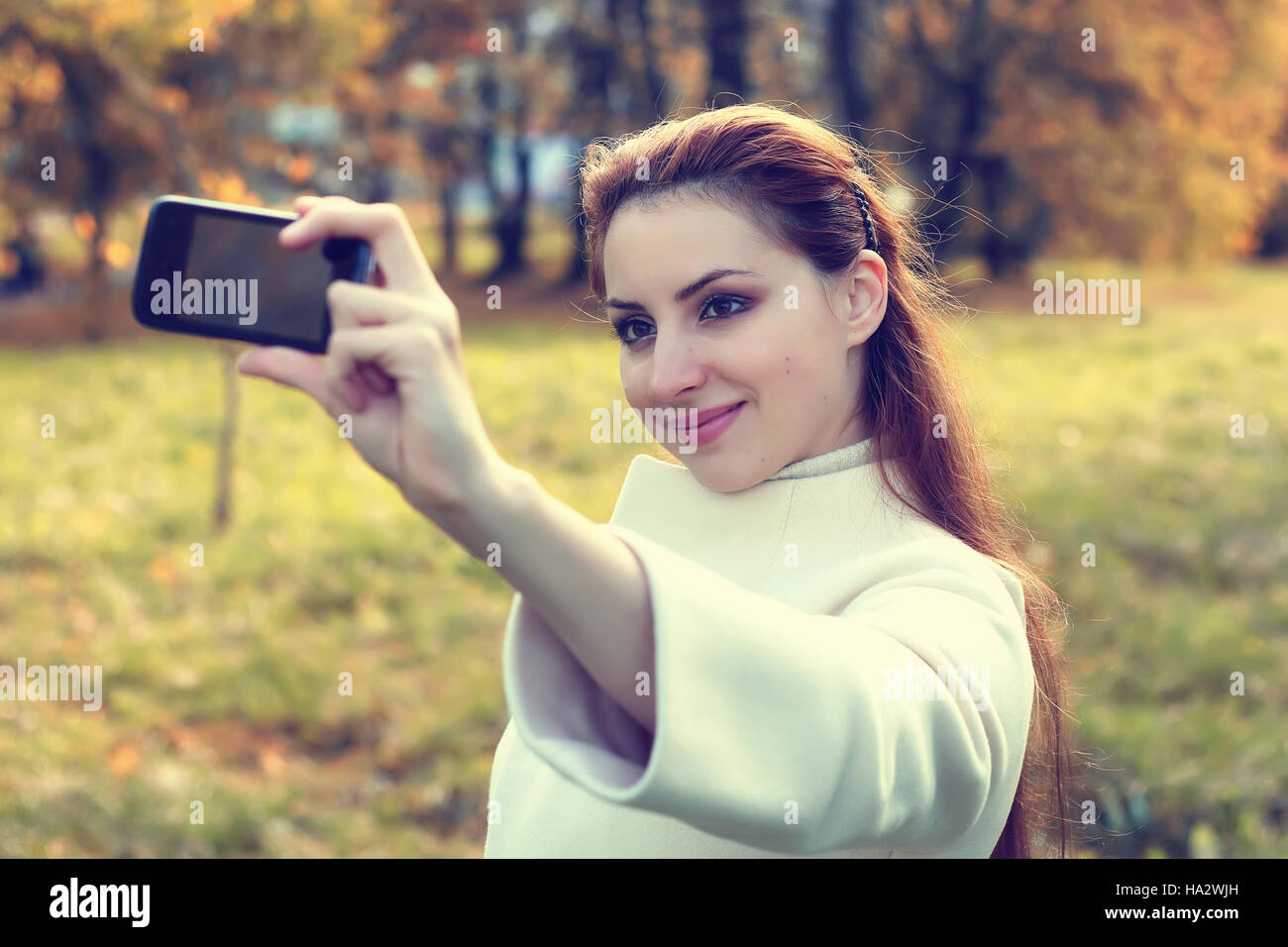 girl in a park walk autumn alone Stock Photo - Alamy