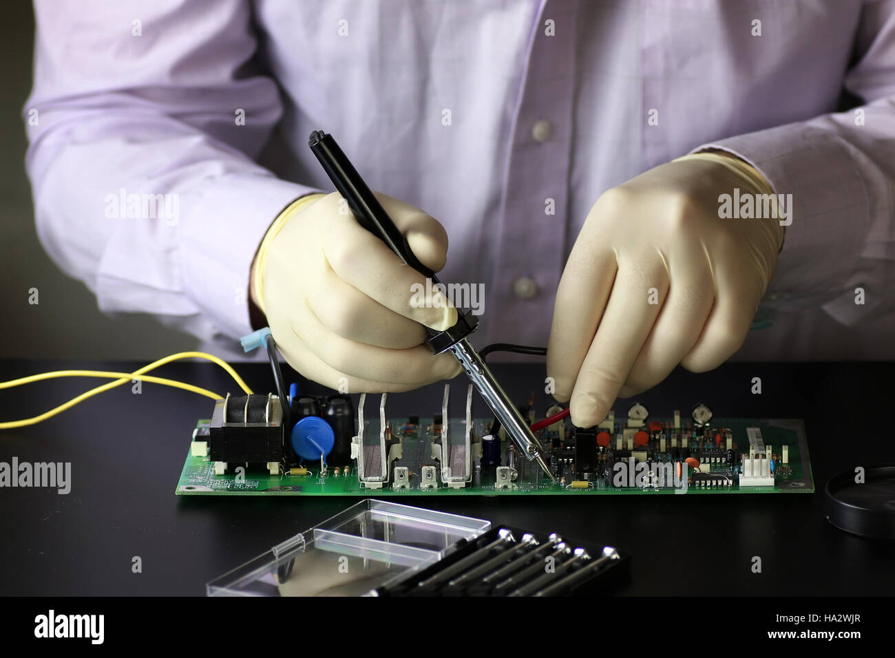 chip soldering man hands Stock Photo - Alamy