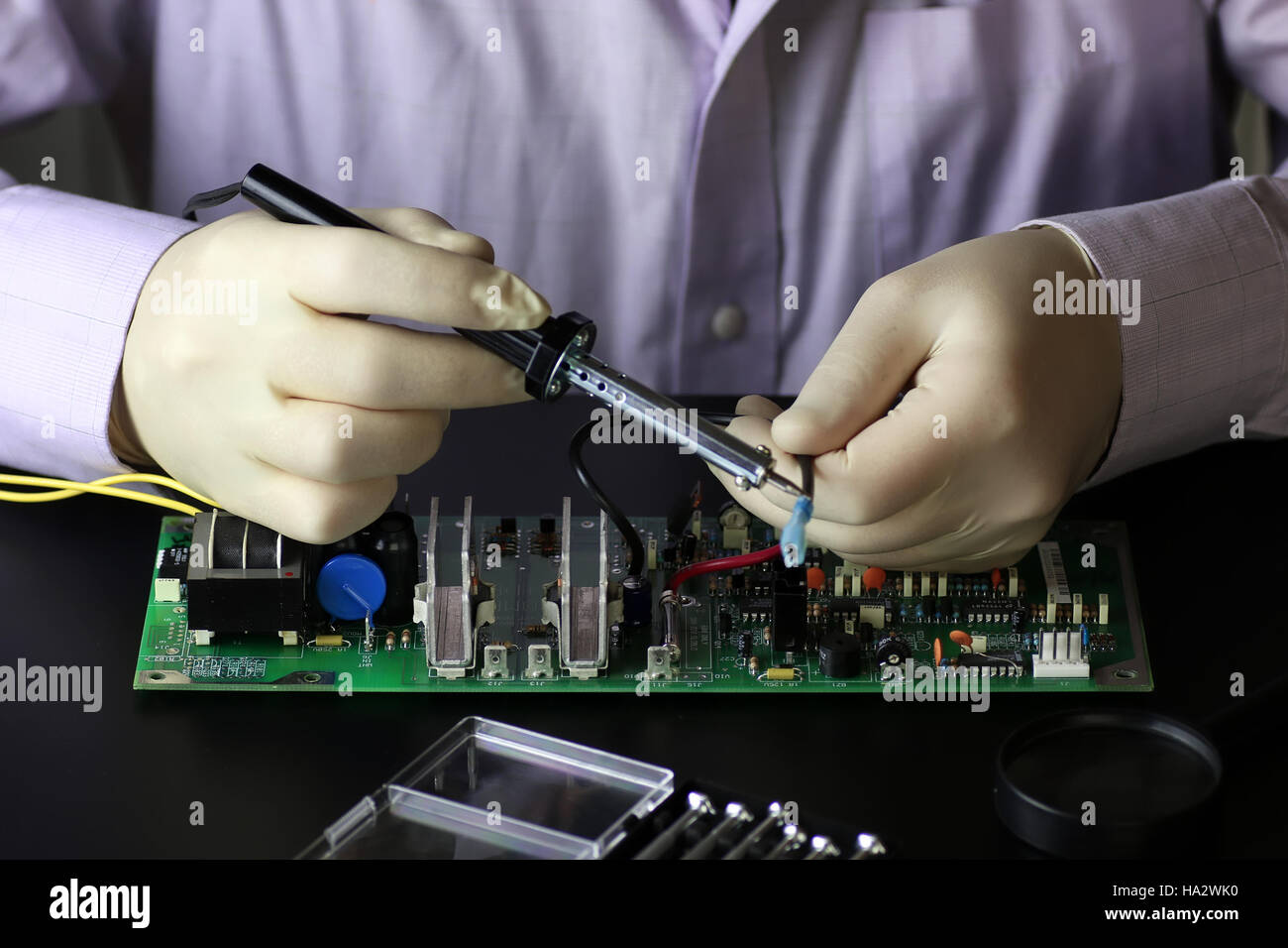 chip soldering man hands Stock Photo - Alamy