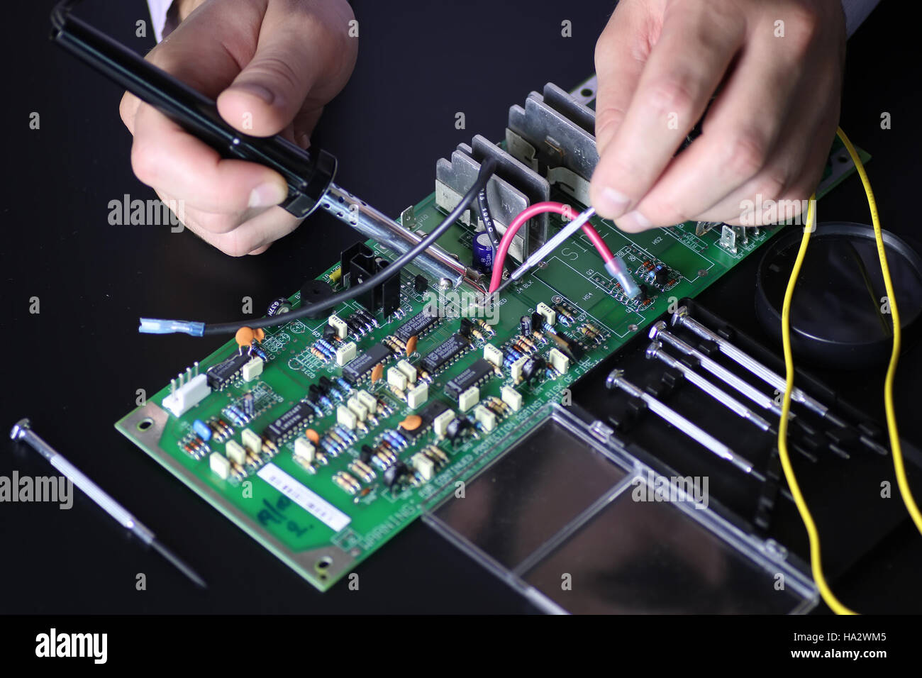 man hands chip soldering tools Stock Photo - Alamy