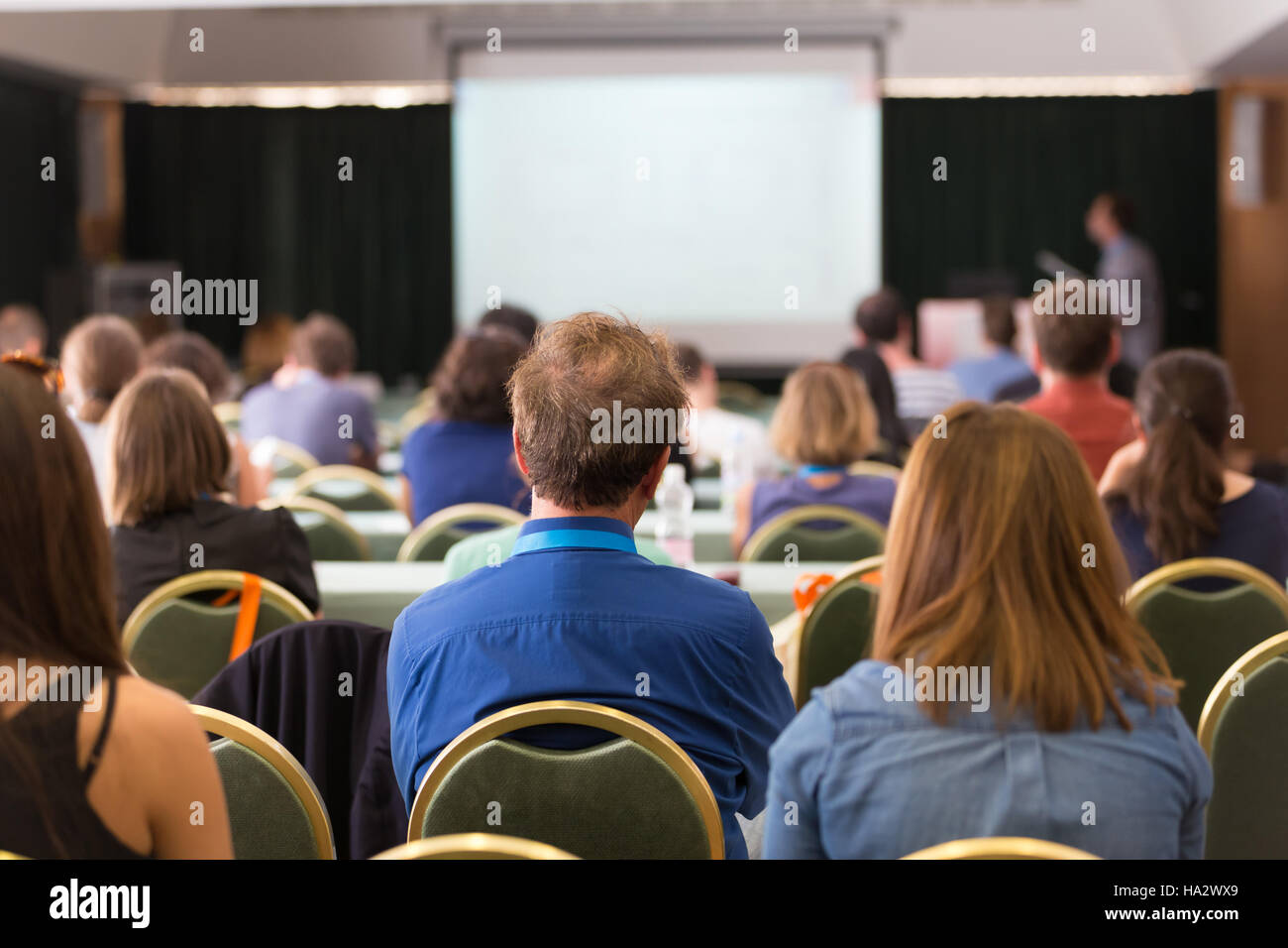 Audience in lecture hall participating at business conference Stock ...