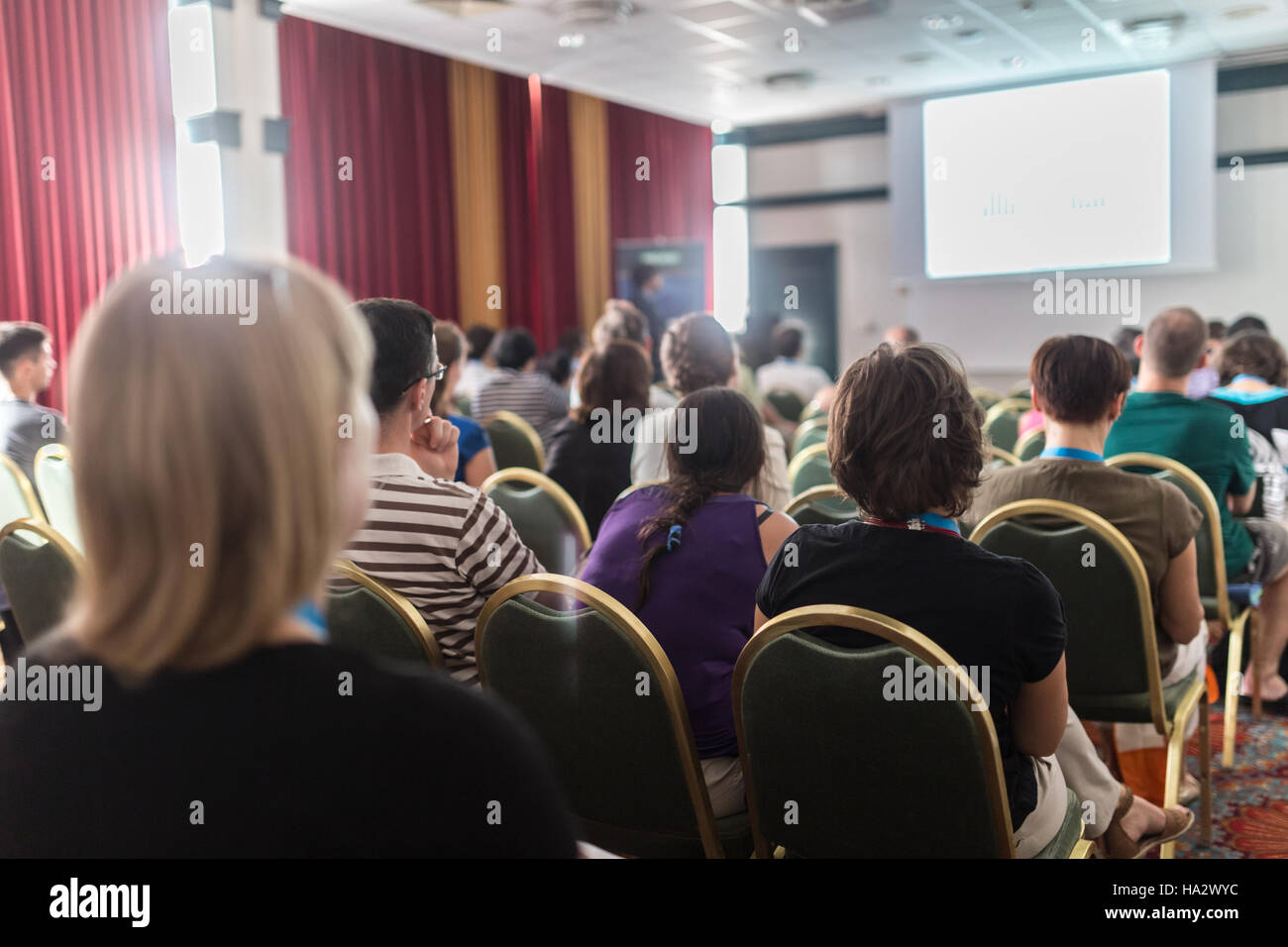Audience in lecture hall participating at business conference Stock ...