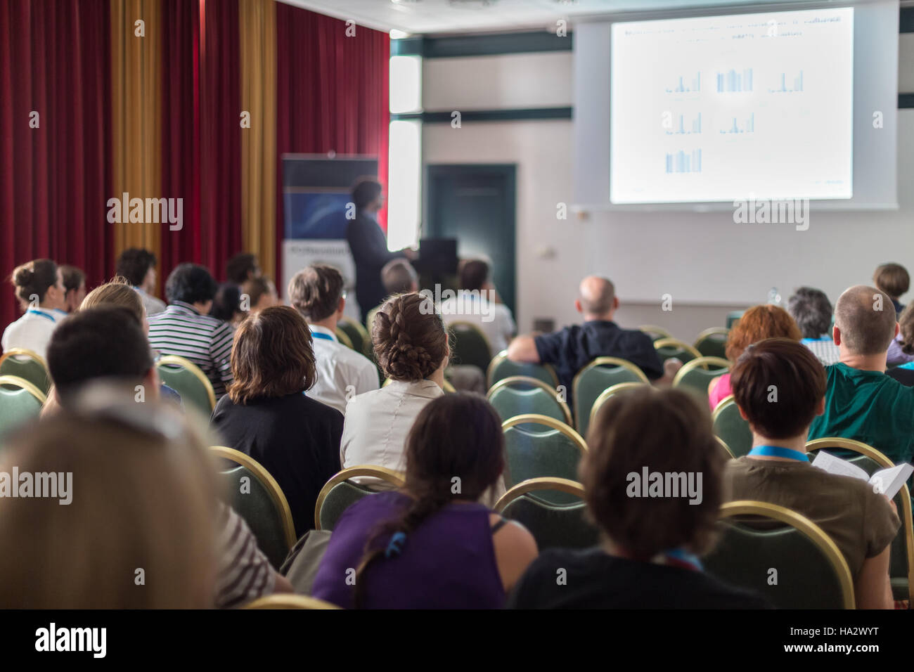 Audience in lecture hall participating at business conference Stock ...