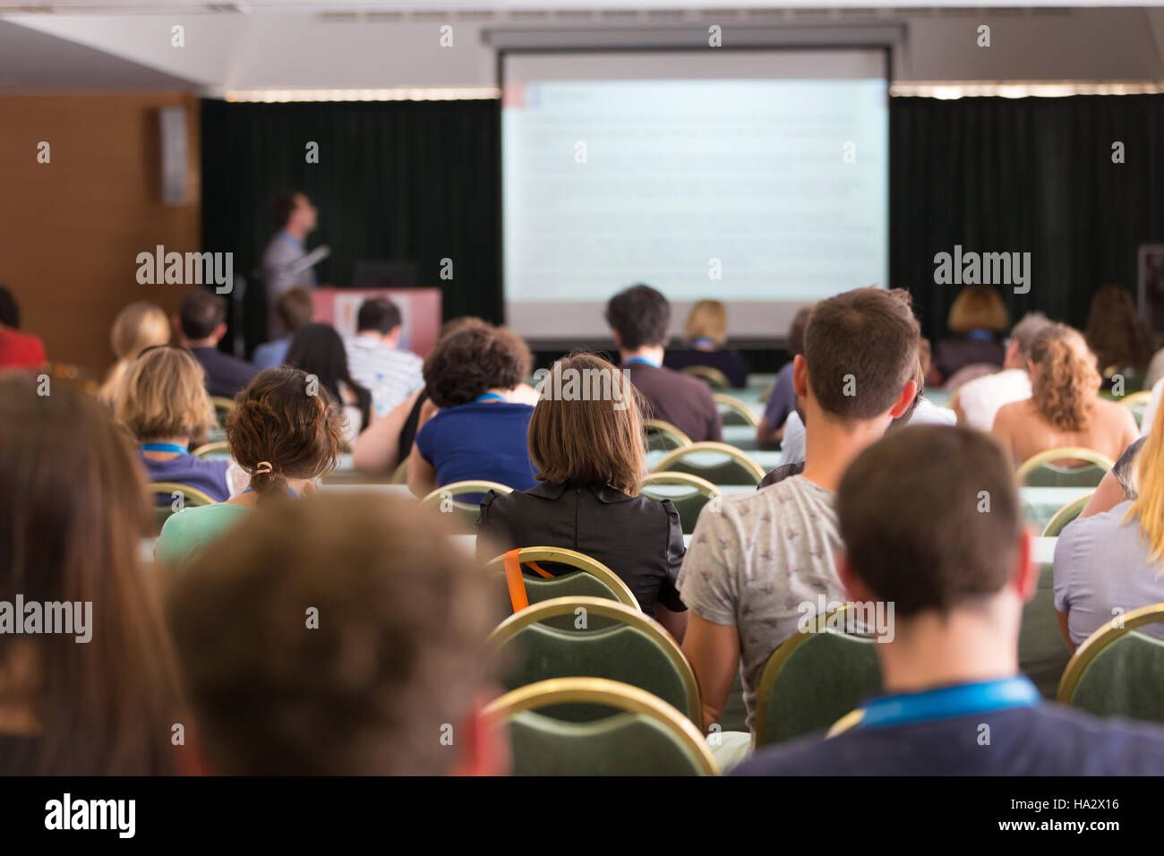 Audience in lecture hall participating at business conference Stock ...