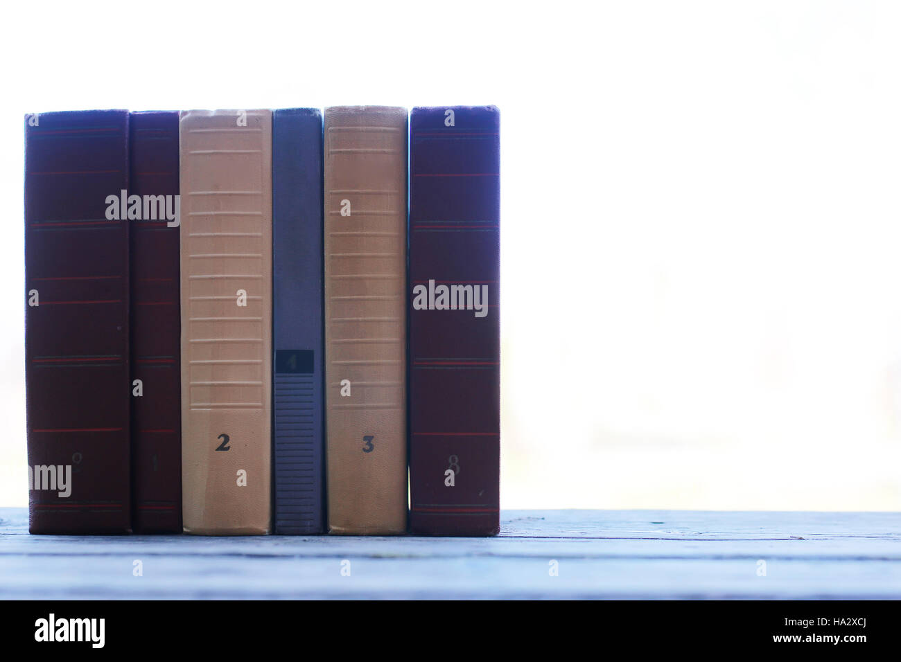 books standing on a table Stock Photo - Alamy