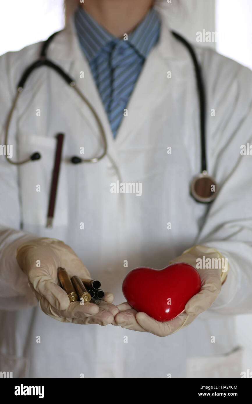 heart and sleeve in doctor hand Stock Photo - Alamy
