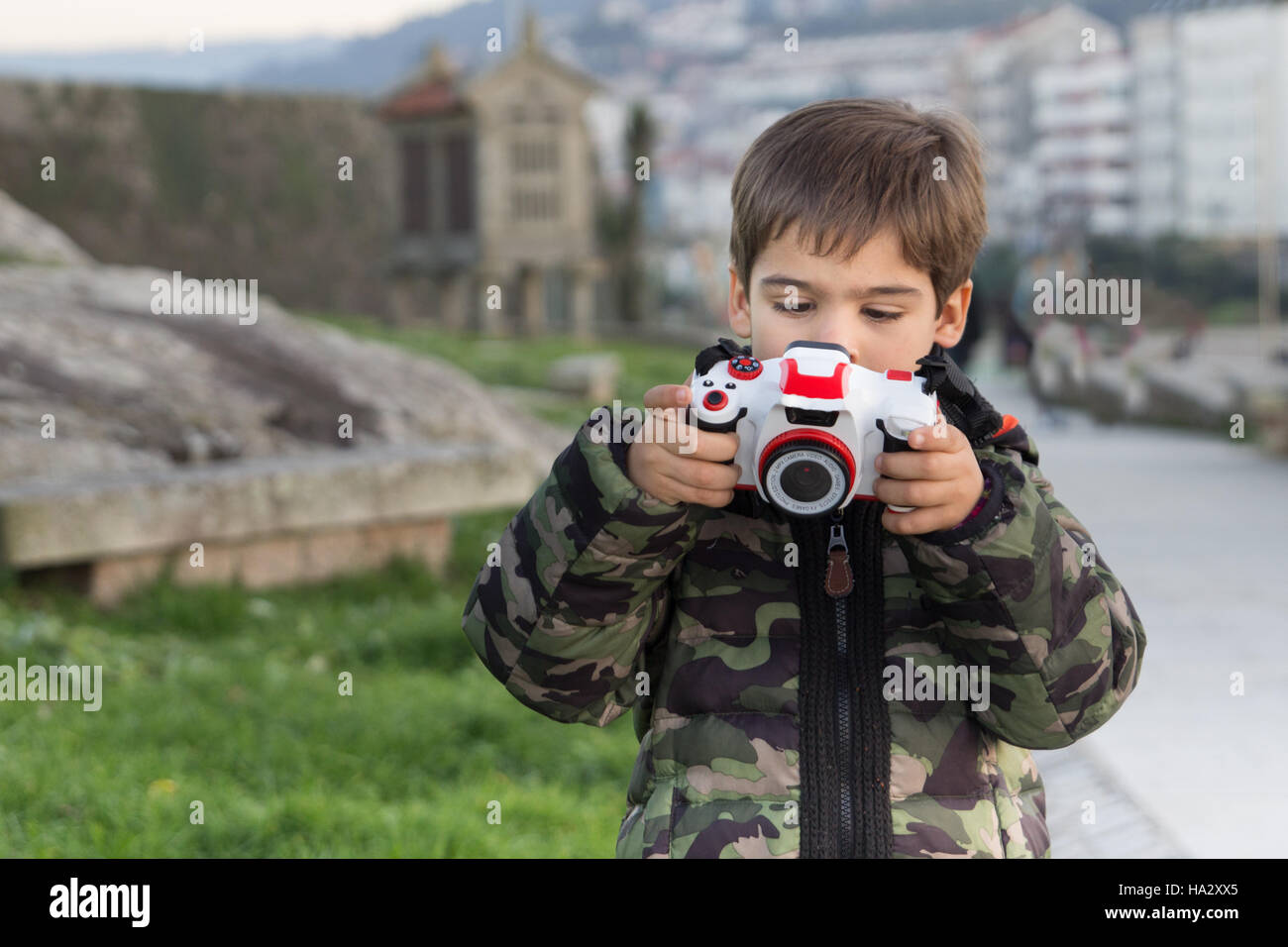 Boy with a toy camera Stock Photo - Alamy
