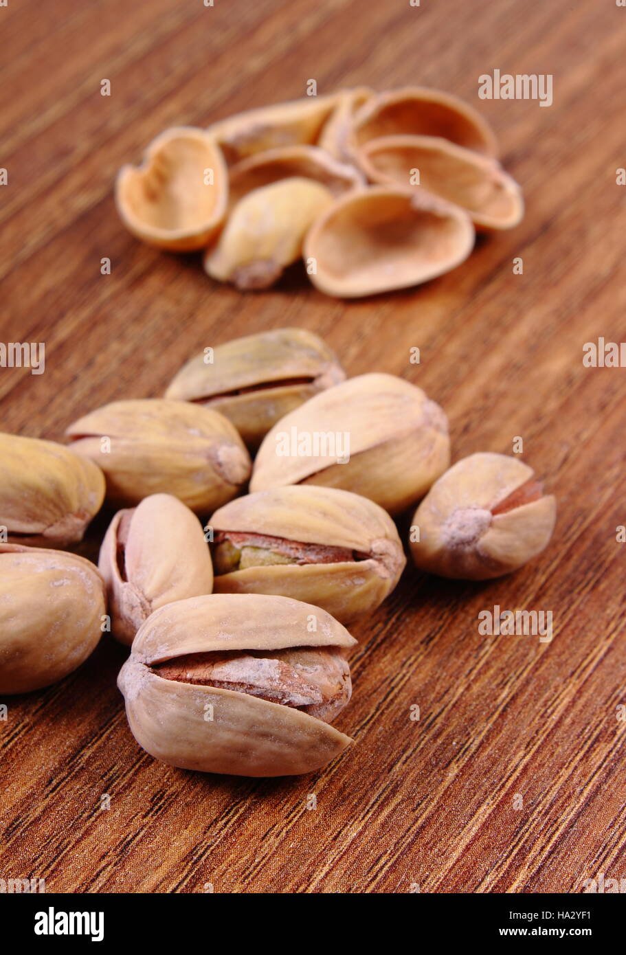 Roasted pistachio nuts with shells on rustic board, healthy food and nutrition Stock Photo - Alamy