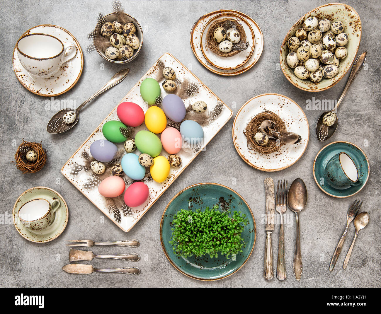 Easter dinner decorations. Table place setting with colored eggs Stock ...