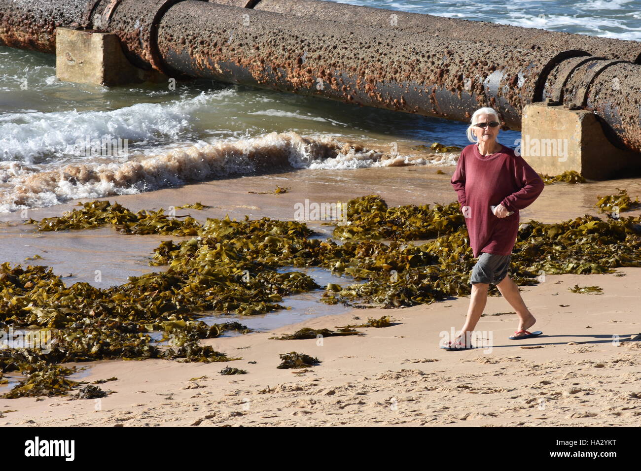 Lady walking by the beach hi-res stock photography and images - Alamy