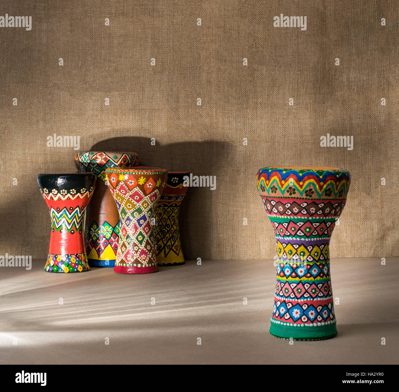 Front view of decorated colorful pottery goblet drum on background of ...